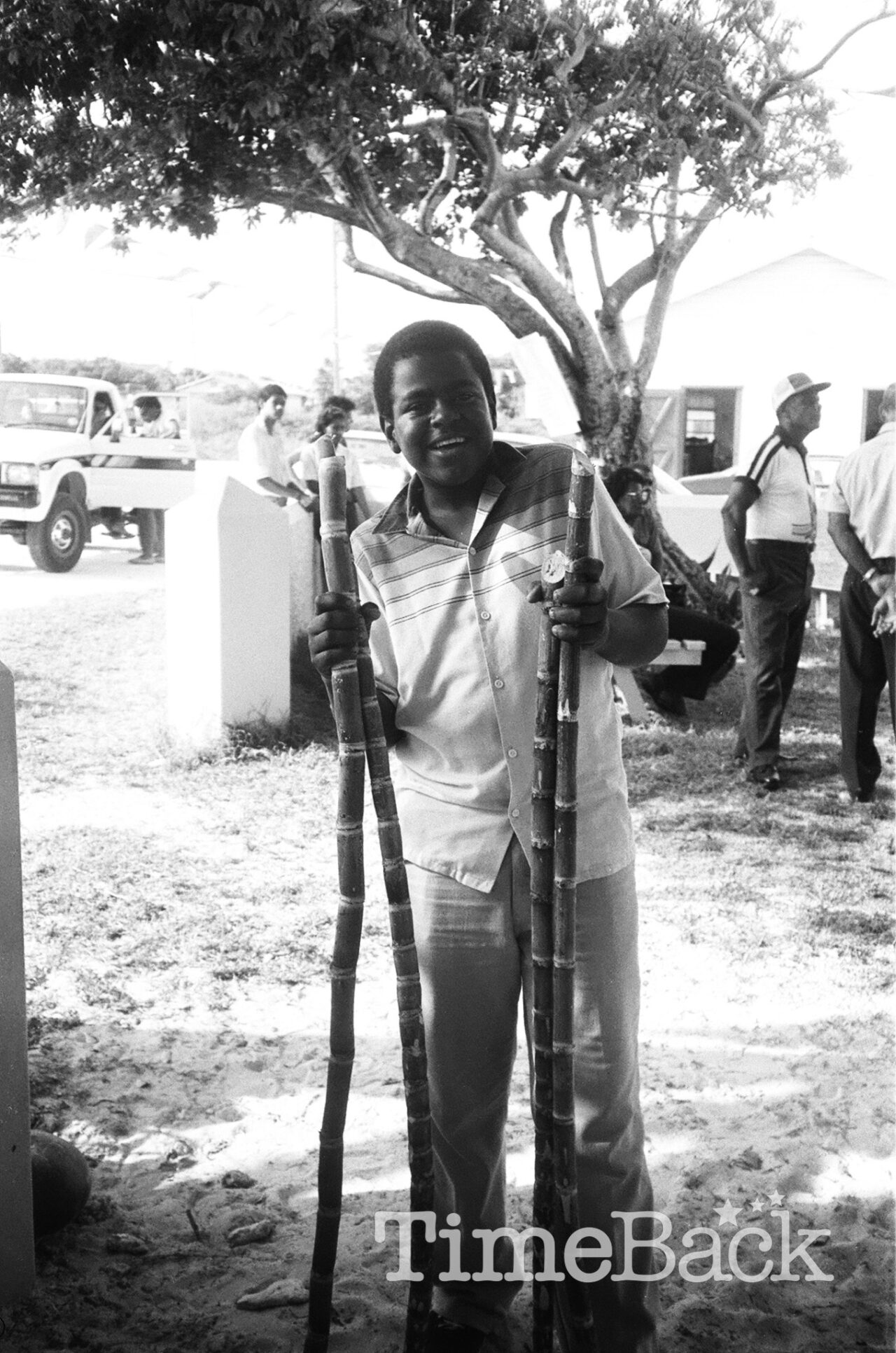Unknown man holding sugar cane in East End, 1985 | TimeBack